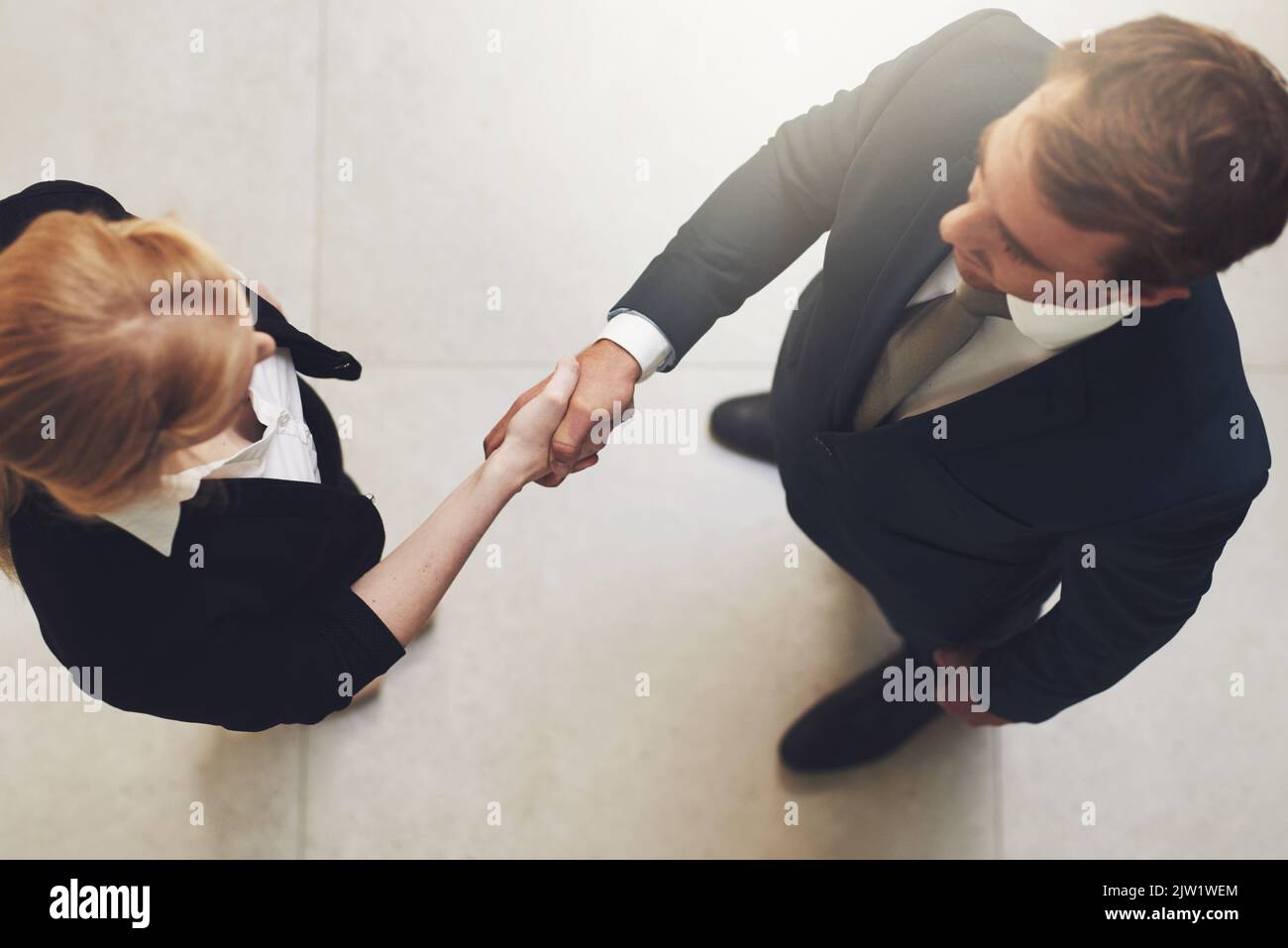 Hand shaking another in hi-res stock photography and images - Alamy