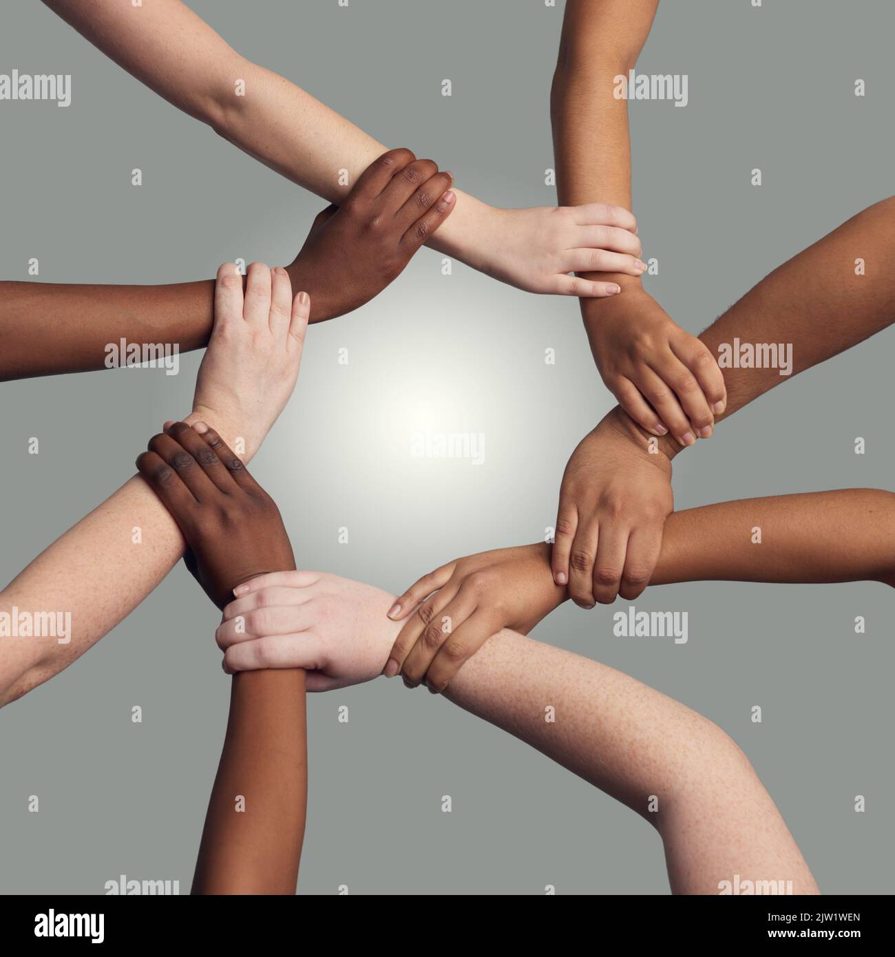 United together for a common cause. a group of hands holding on to each ...