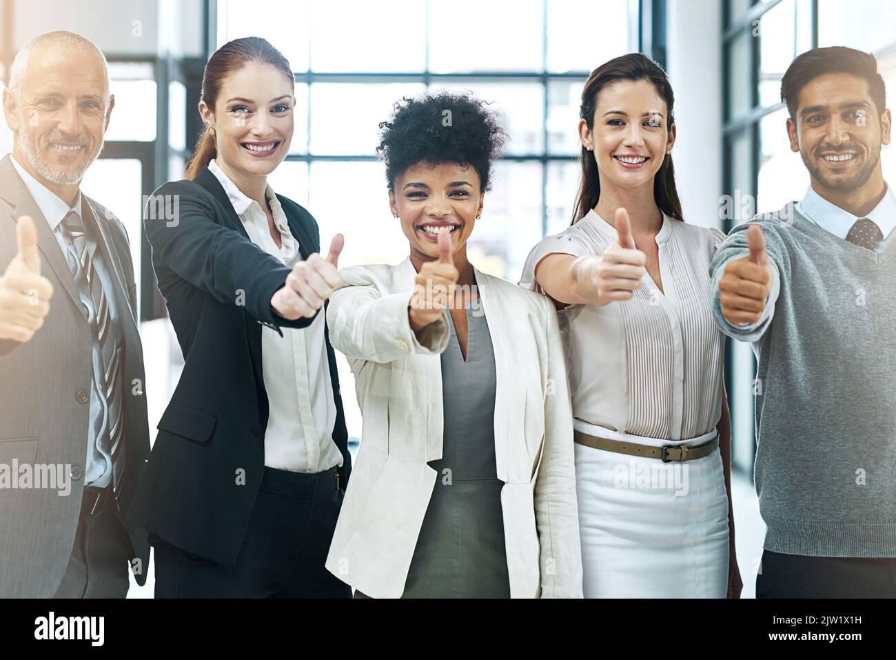 We believe in you. Portrait of a diverse team of colleagues giving you ...