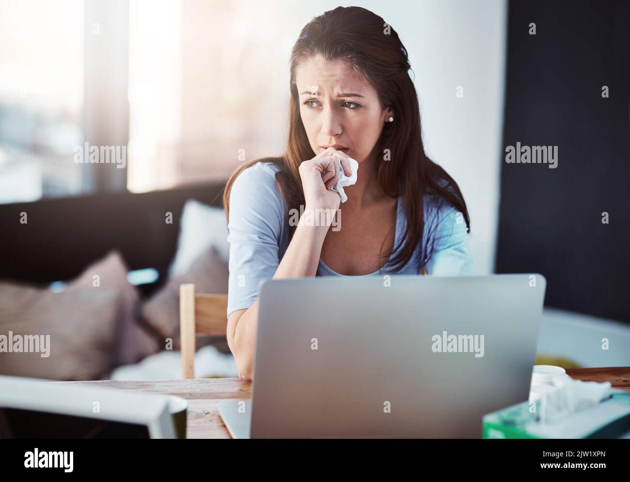 Being sick but has to carry on with work. a young businesswoman trying ...