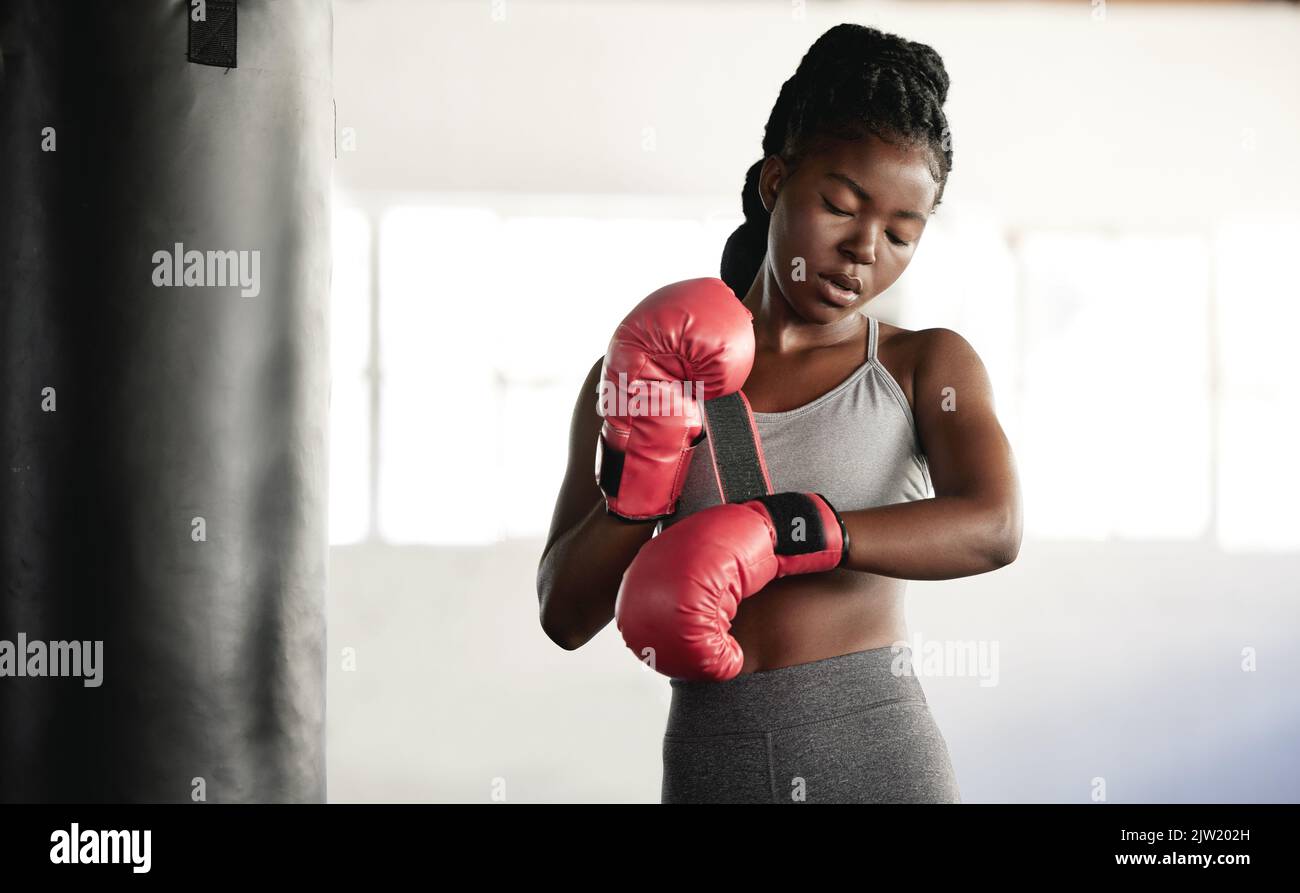 Healthy, fitness and cardio woman boxer thinking about a fight, competition or match in the gym ...