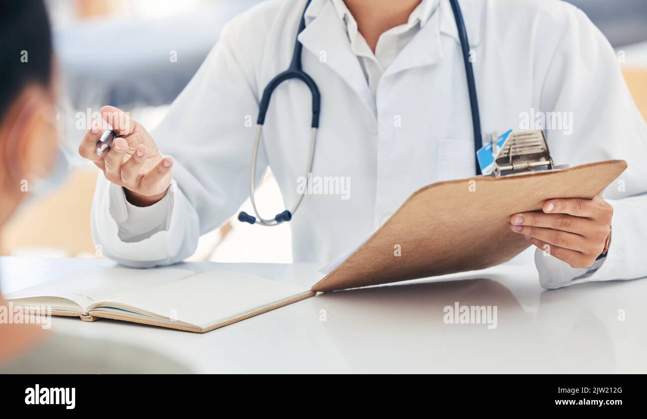 Doctor talking about health insurance at clinic, healthcare worker in ...