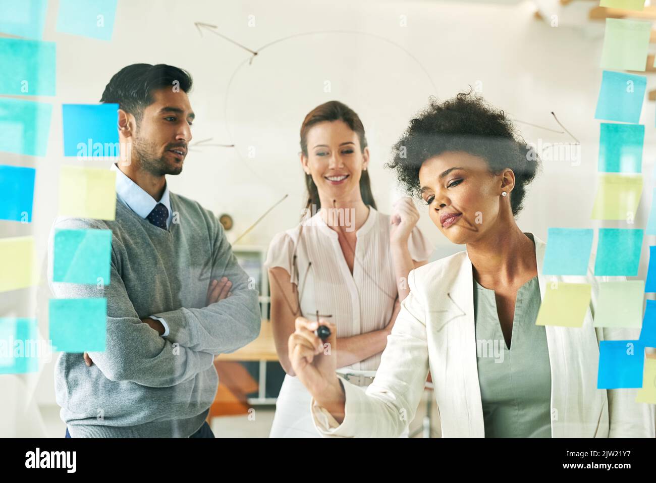 One challenge, many solutions. a group of young colleagues having a brainstorming session at ...