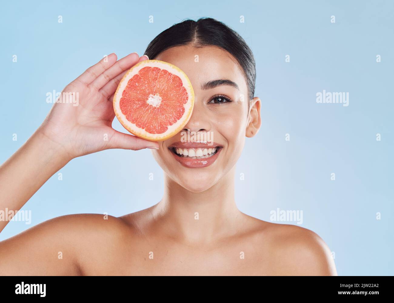 Fruit, beauty and skin of a woman with smile holding a grapefruit on ...