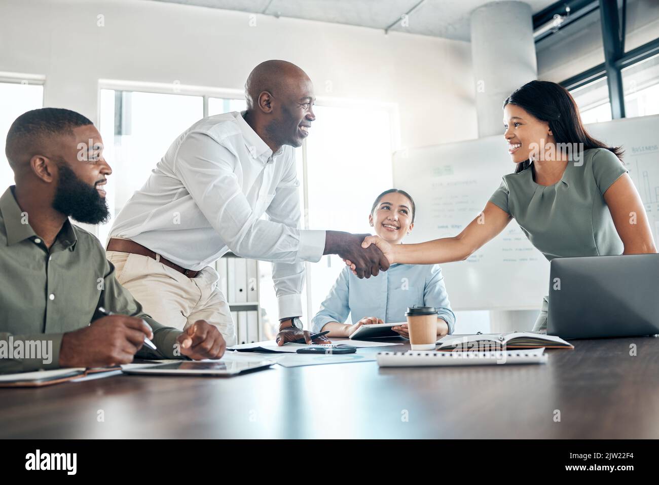 Handshake, office diversity and meeting welcome for company onboarding ...