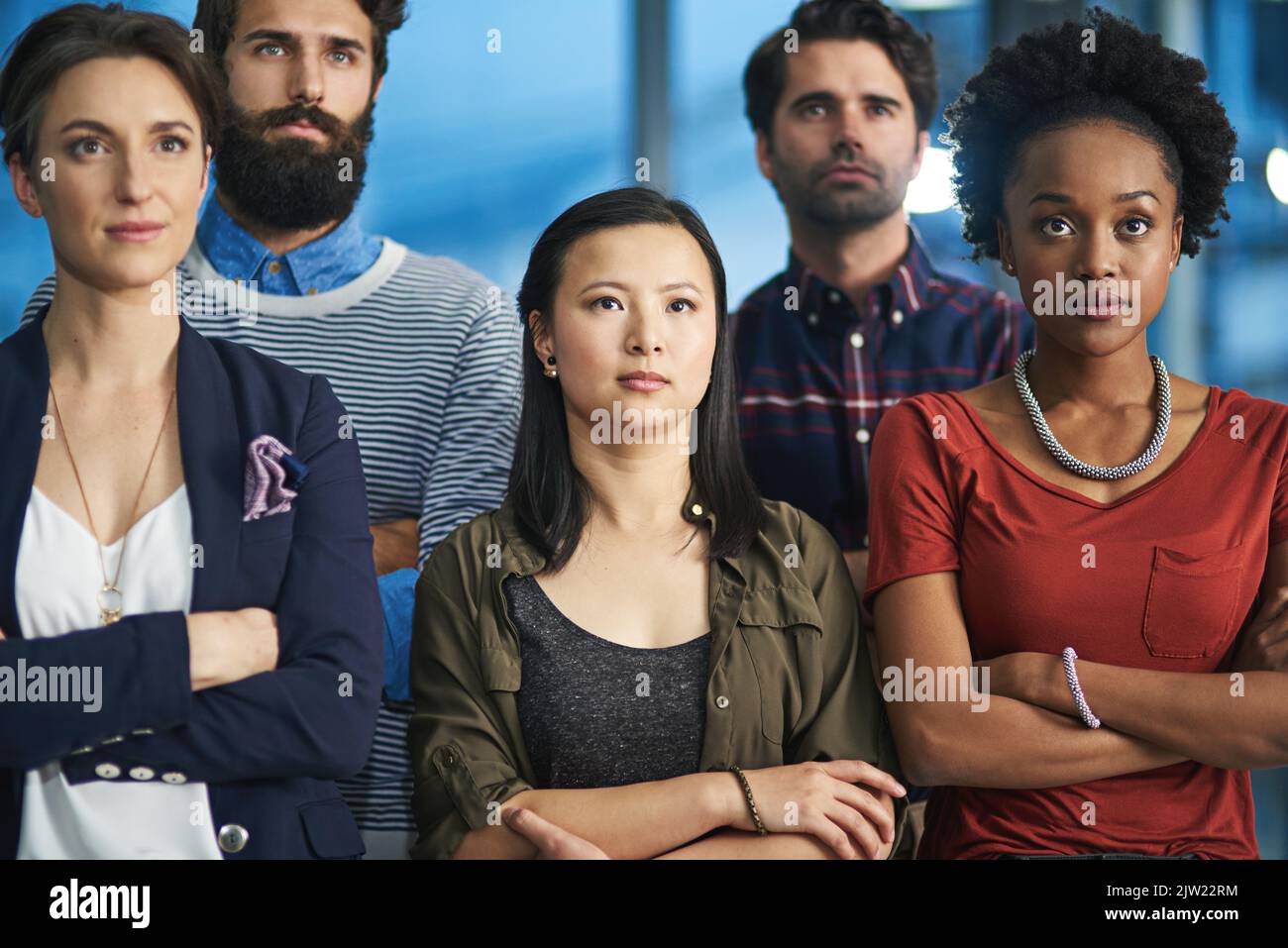 Were ready for anything. a group of creative businesspeople looking ...