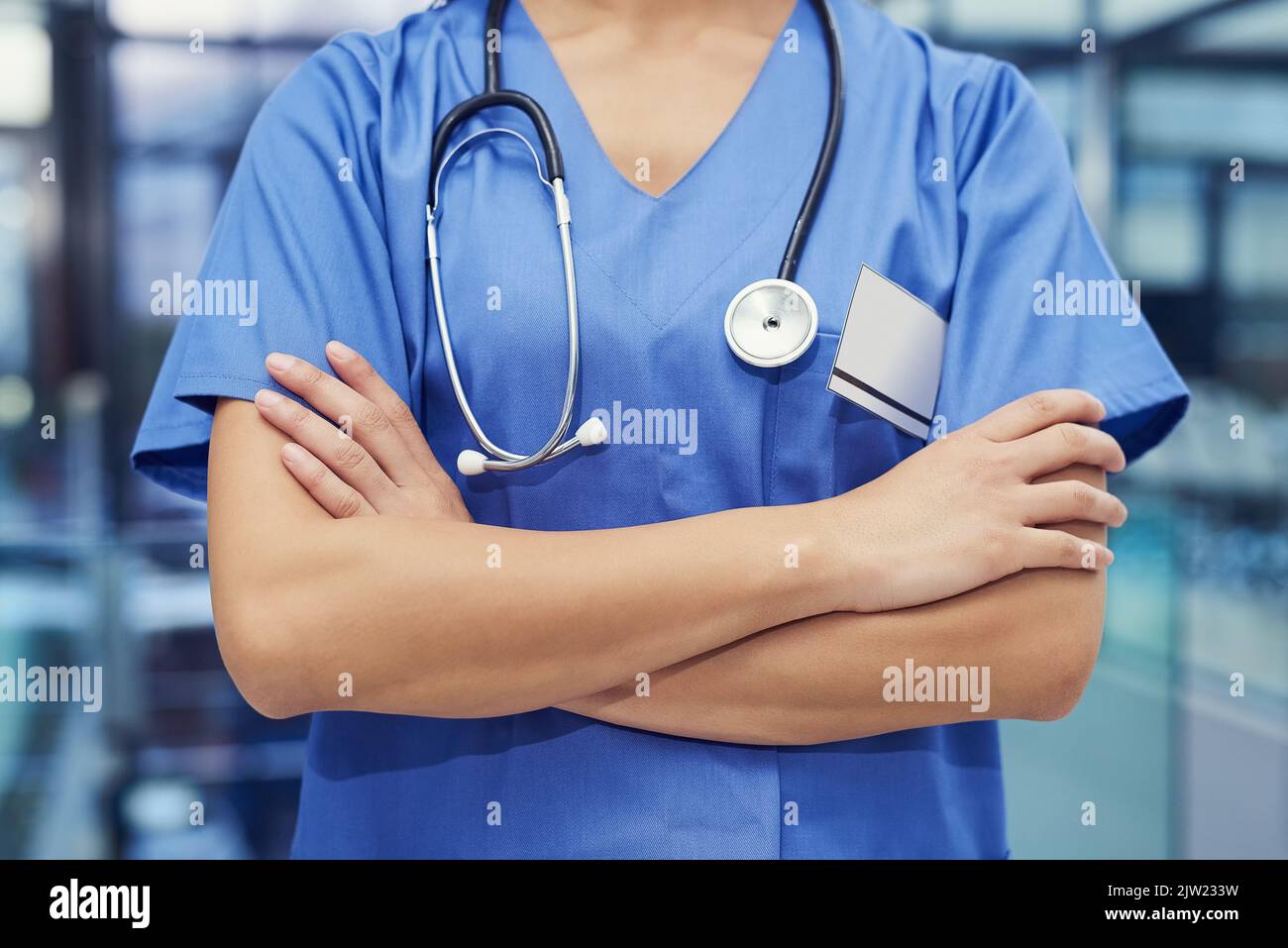 Dedicated to saving lives. Portrait of a young female doctor standing ...