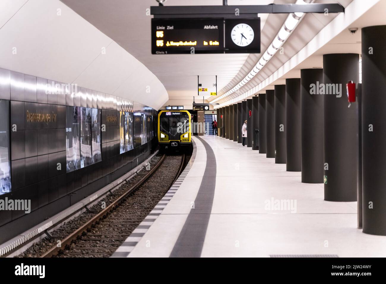 The view of the yellow train arriving at the Berlin subway station with ...