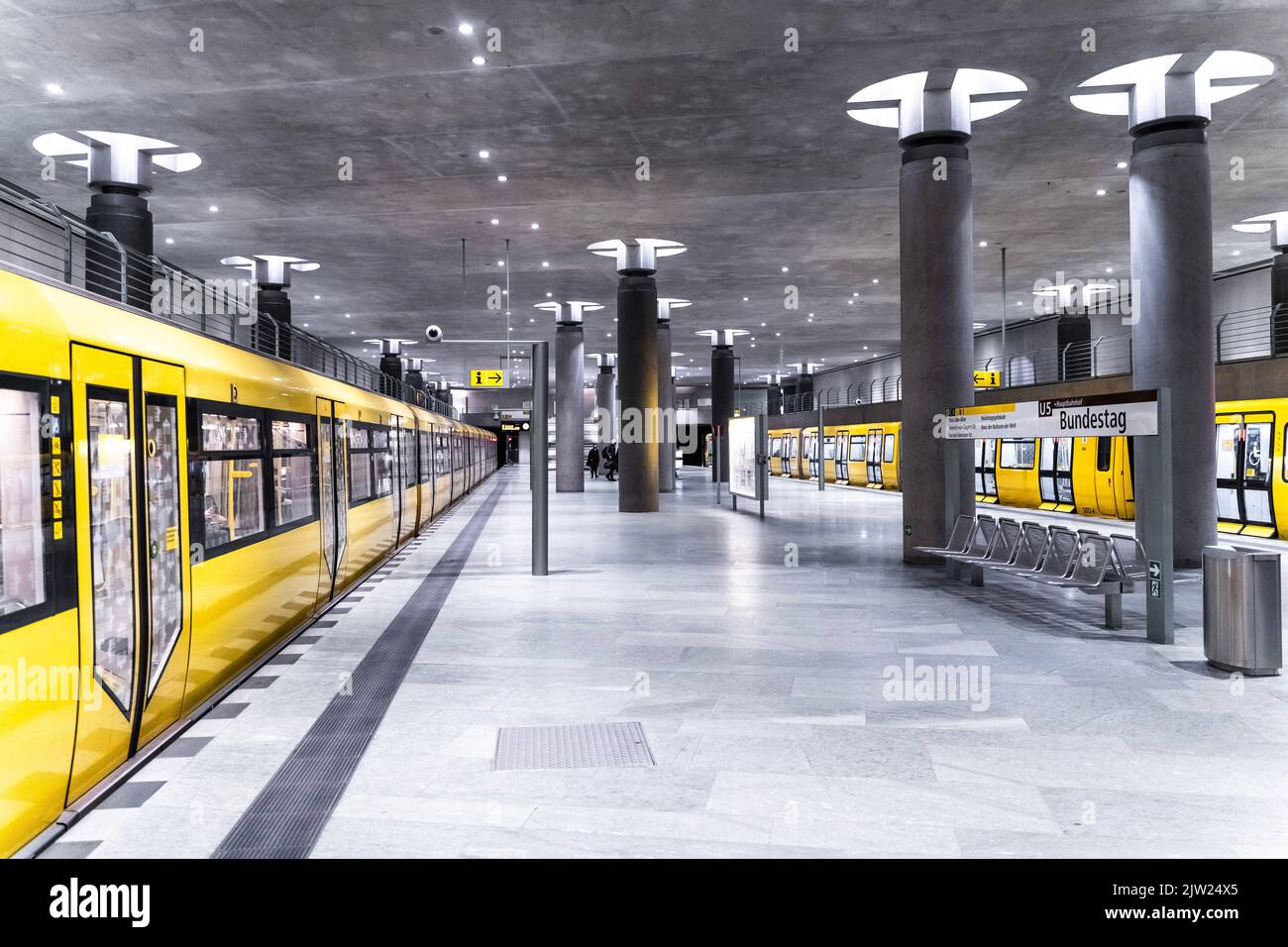 The view of the yellow trains at the Berlin subway station with black ...