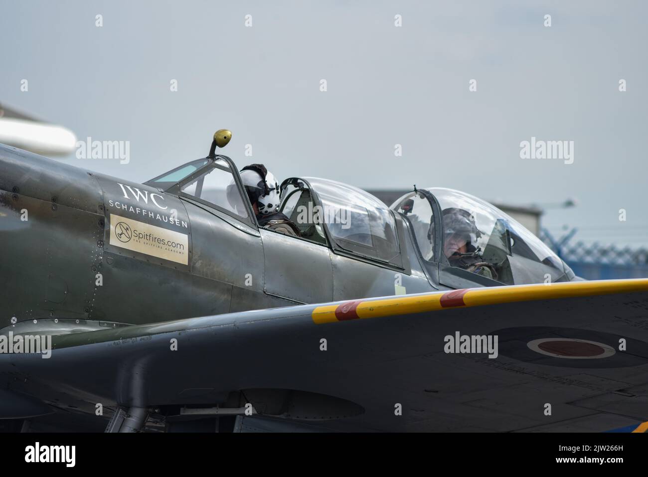 SM250 twin seat Spitfire taxiing on the runway of Solent airport. Both ...