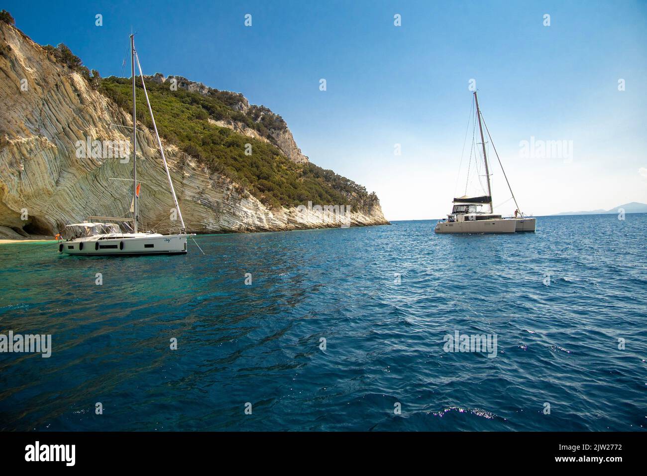 A beautiful view of the sailing boats in the sea under the blue sky ...