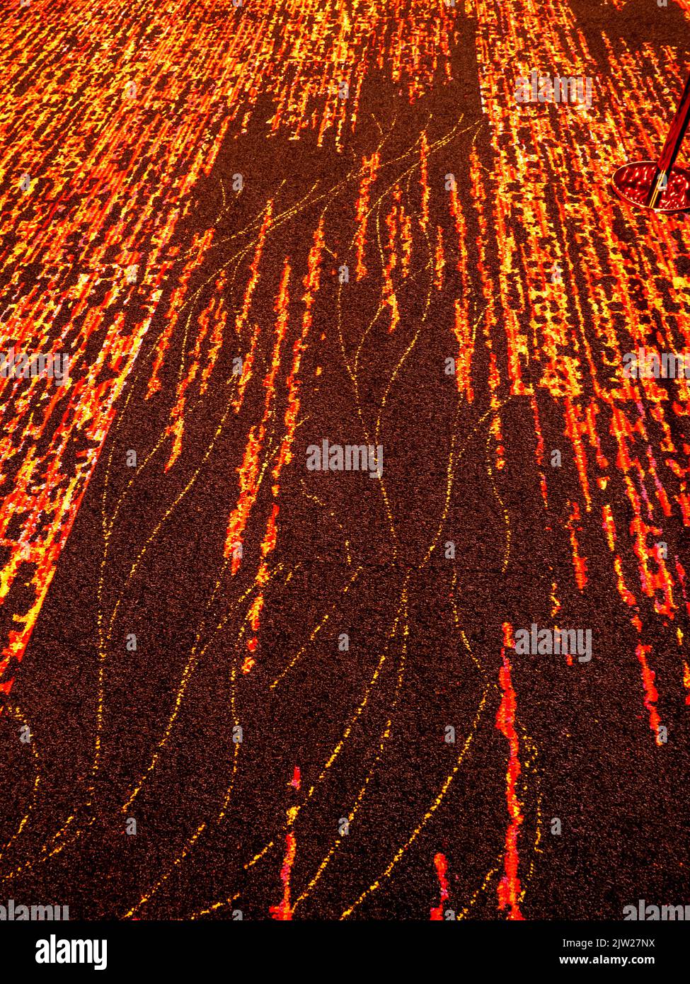 The red pattern looked like a flame on the floor carpet Stock Photo - Alamy