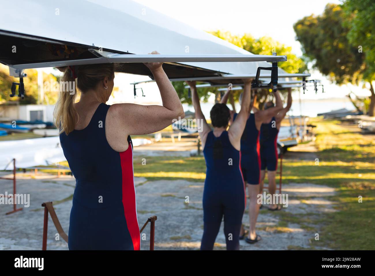 Rowing team carrying boat hi-res stock photography and images - Alamy