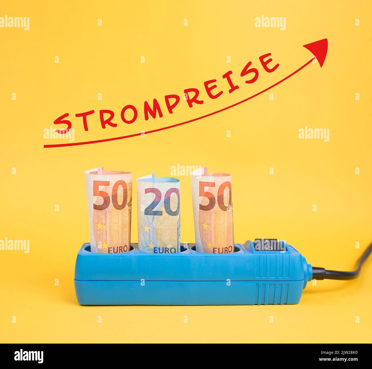 Euro banknotes in a power outlet, increasing prices for electricity is ...