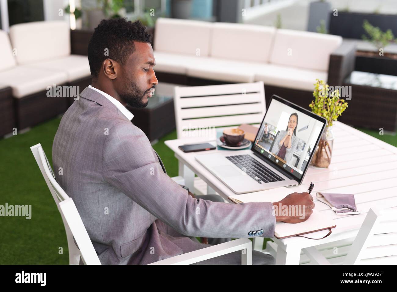 Multiracial male and female business colleagues discussing work through ...