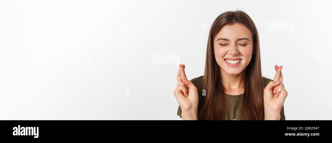 Closeup portrait hopeful beautiful woman crossing her fingers, open ...