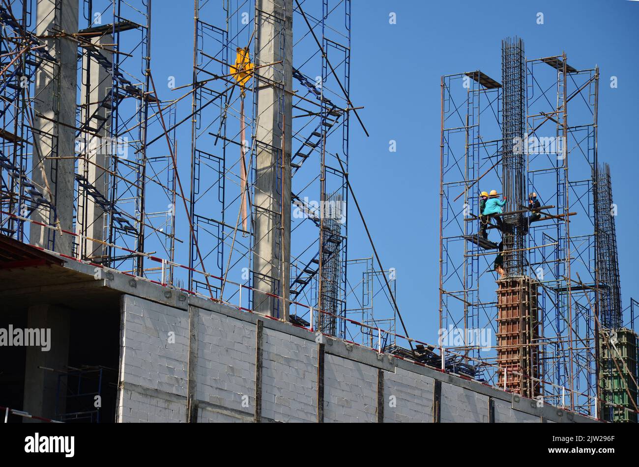 Asian labor people and thai labour workers use machine and heavy ...