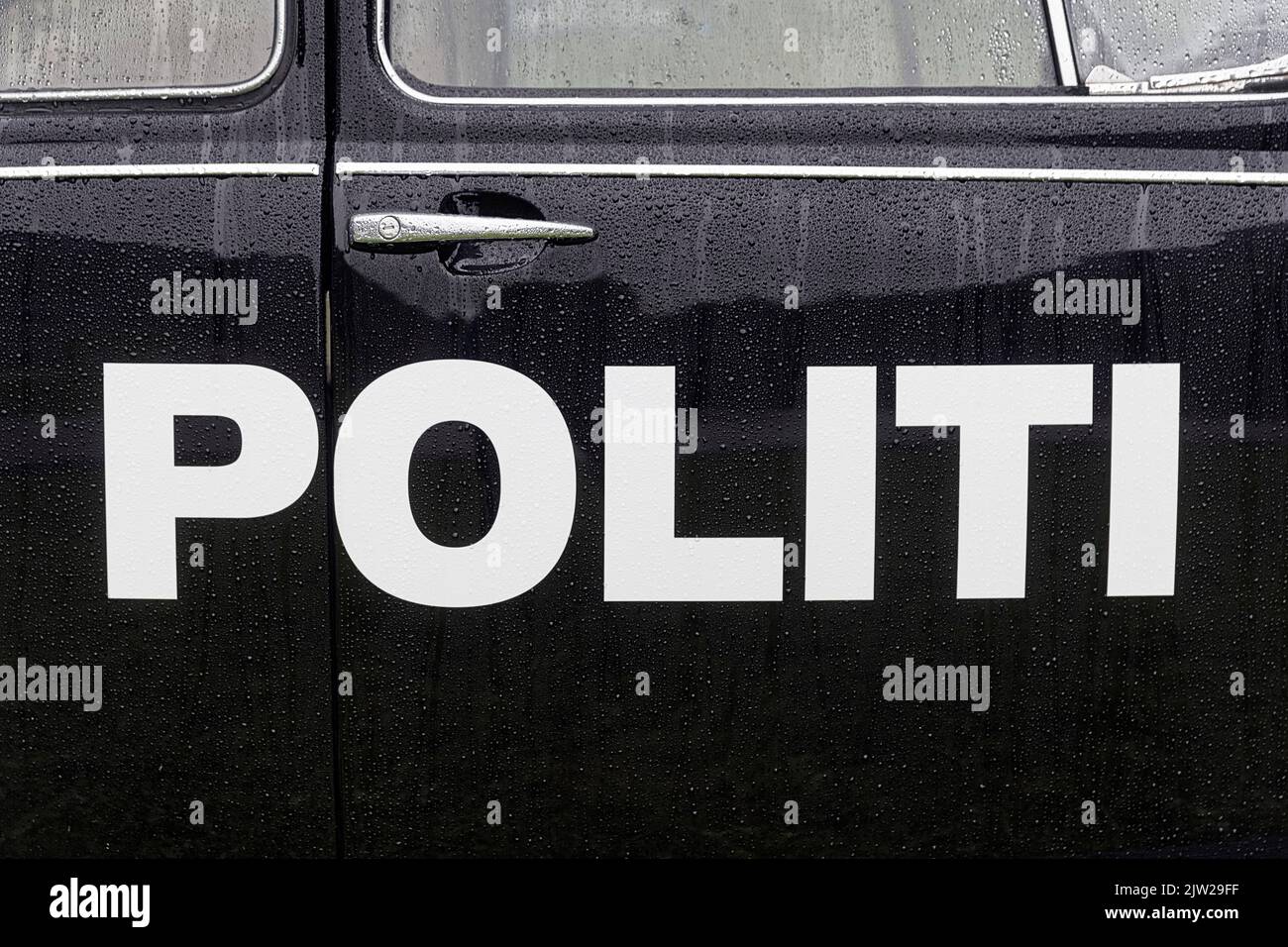 White inscription Politi, police on black patrol car VW Beetle, classic ...