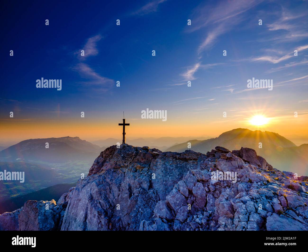 New summit cross of the Kleiner Watzmann at sunrise, Untersberg and ...