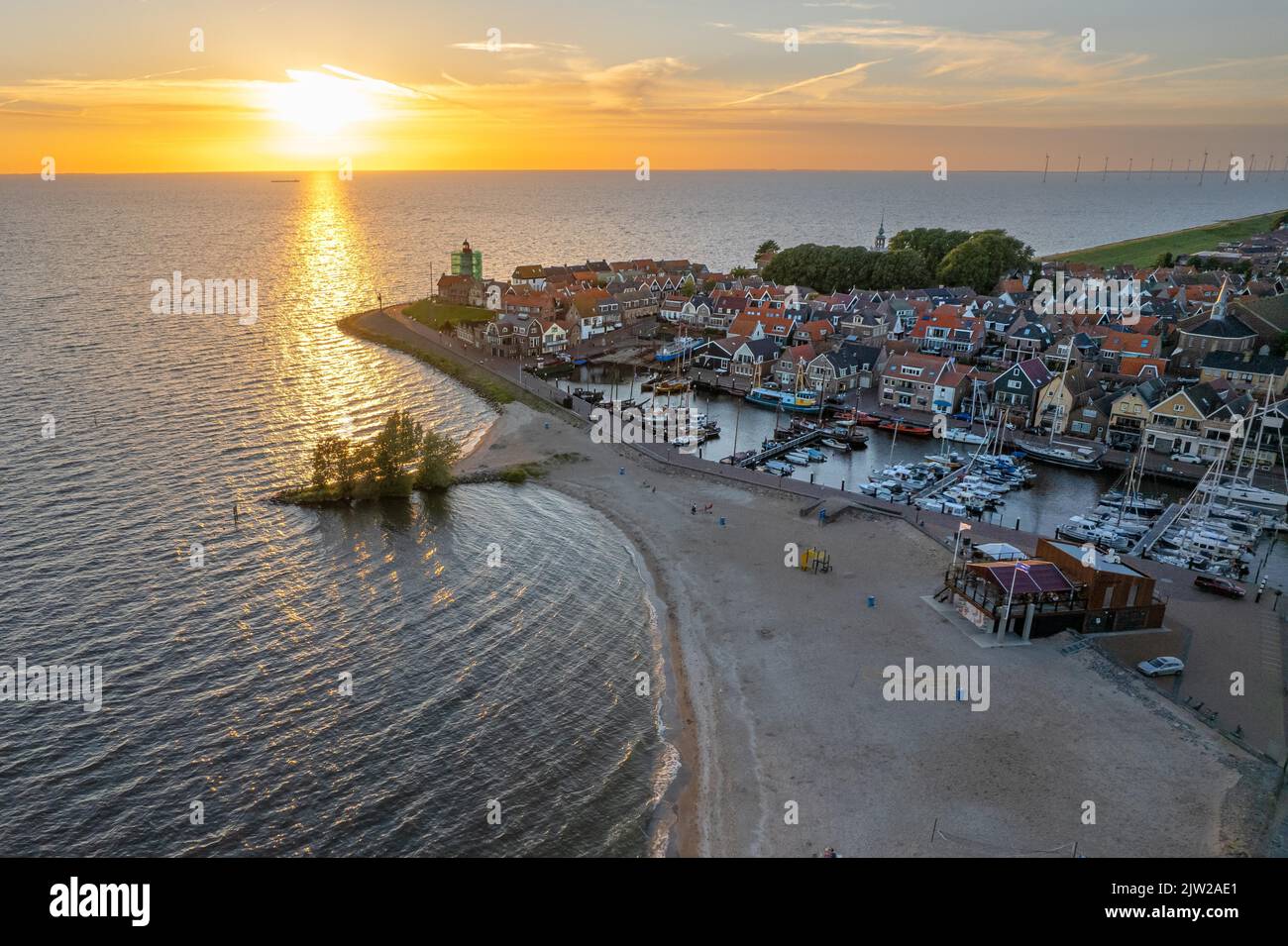 Stand and harbour at sunset, Ijsselmeer, Urk, Netherlands Stock Photo ...