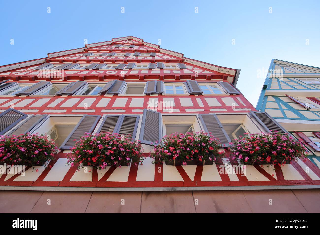 Decorative half-timbered house with view up to the sky at the market ...