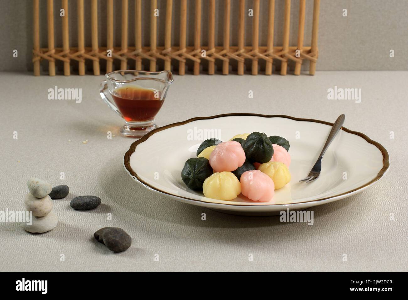 Kkultteok, Ball Shaped Rice Cake Filled with Honey and Sesame Syrup ...