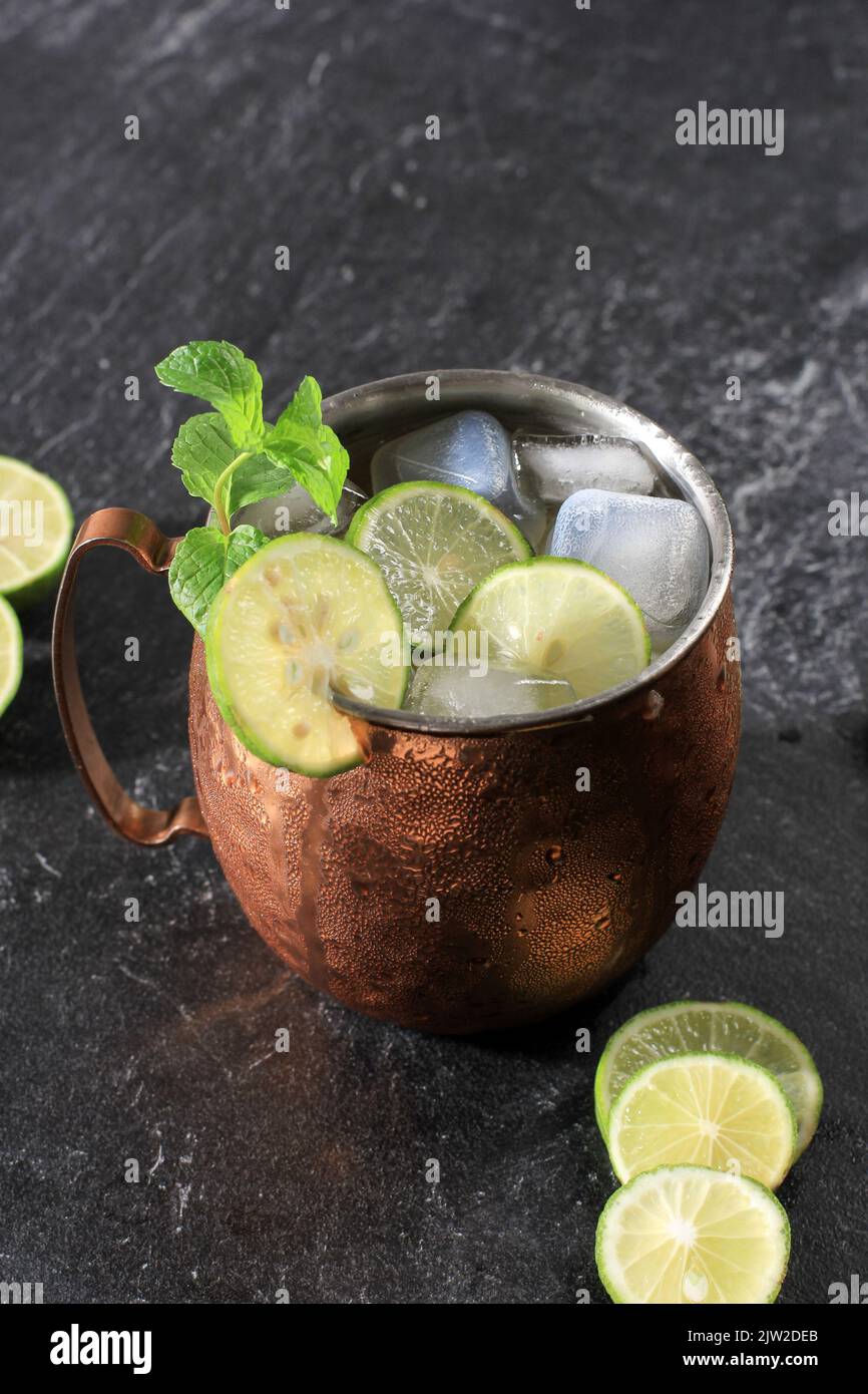 Moscow Mule Alcoholic Cocktail in Copper Mug with Ice, Mint and Sliced ...