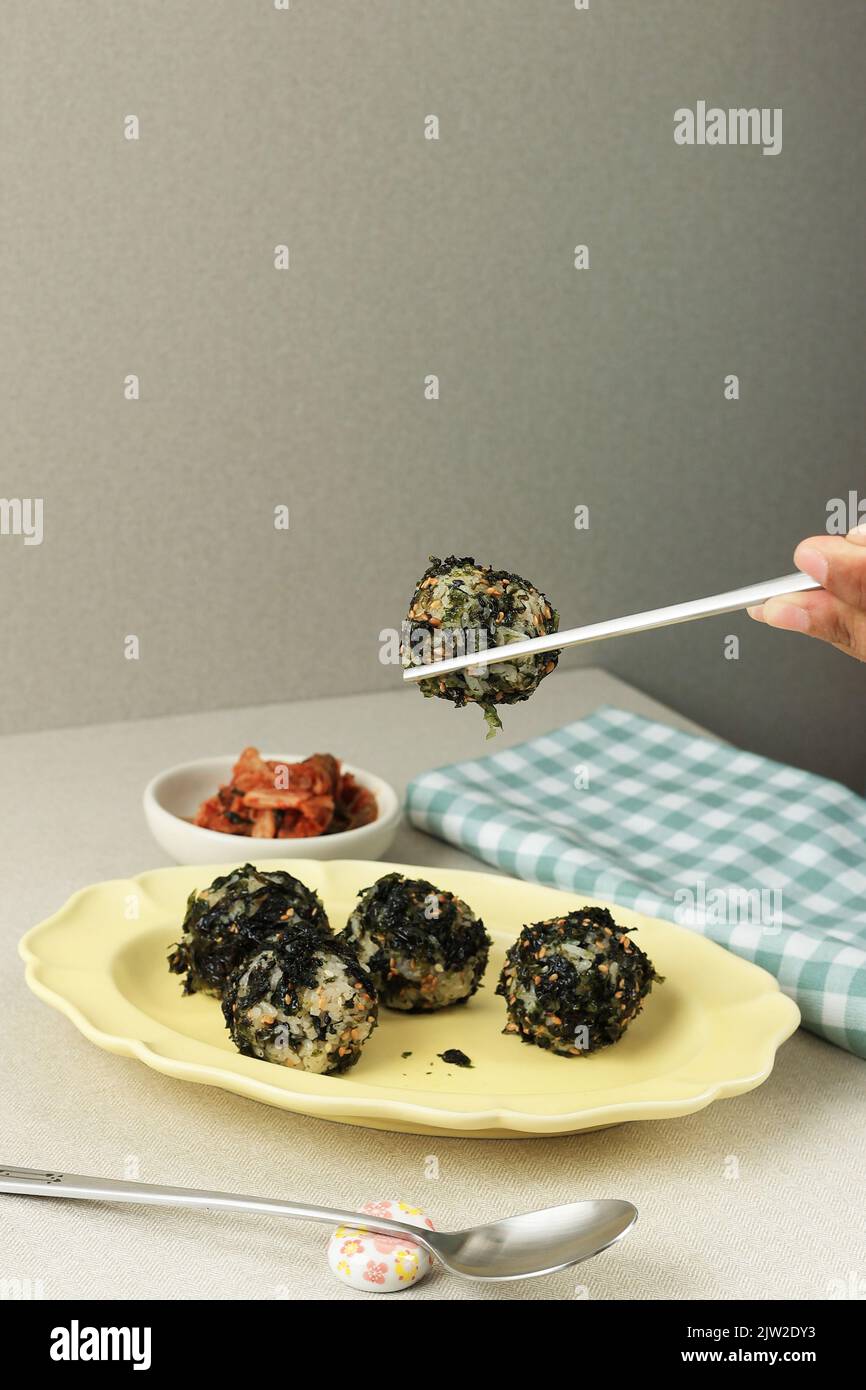 Female Hand Holding Chpstick, Eat Jumeokbap Korean Seaweed Rice Ball ...
