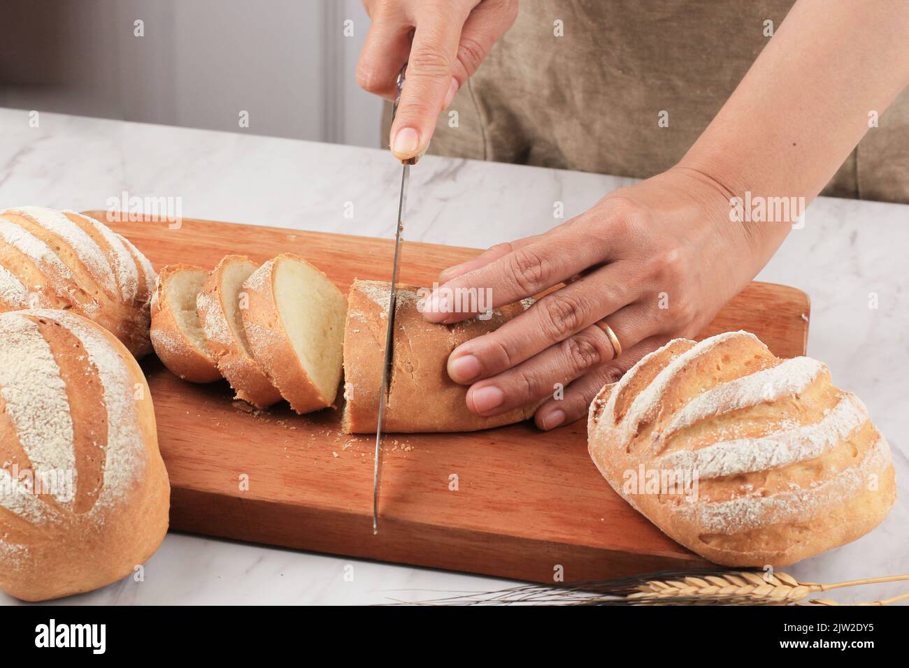 Man cutting bread knife preparing hi-res stock photography and images ...