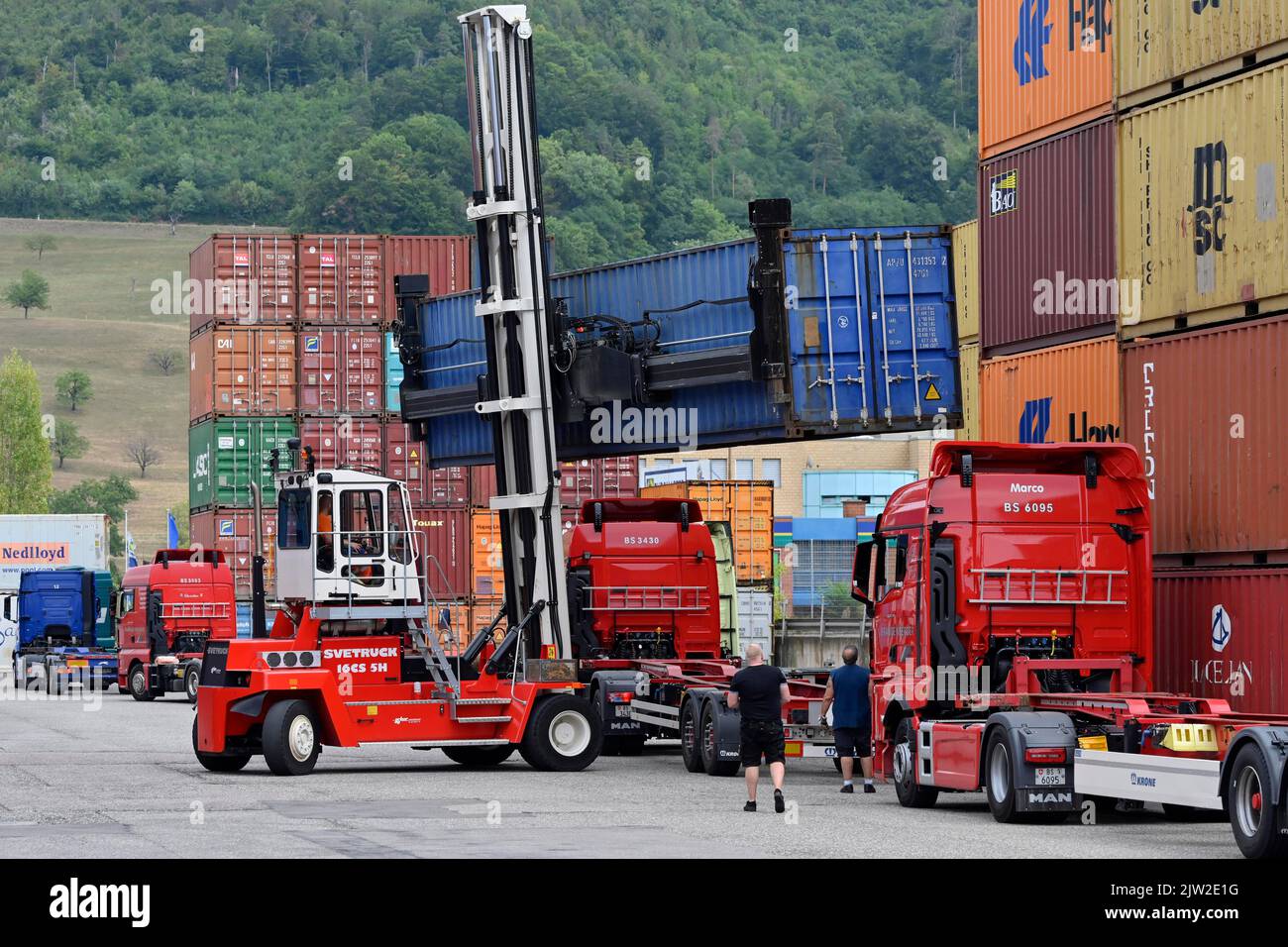 Container stacker loading freight containers Stock Photo - Alamy