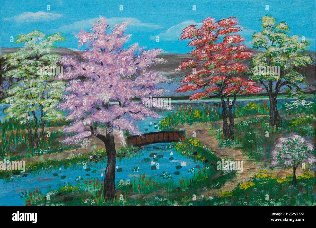 Flowering Trees along the River at Springtime with mountains in ...