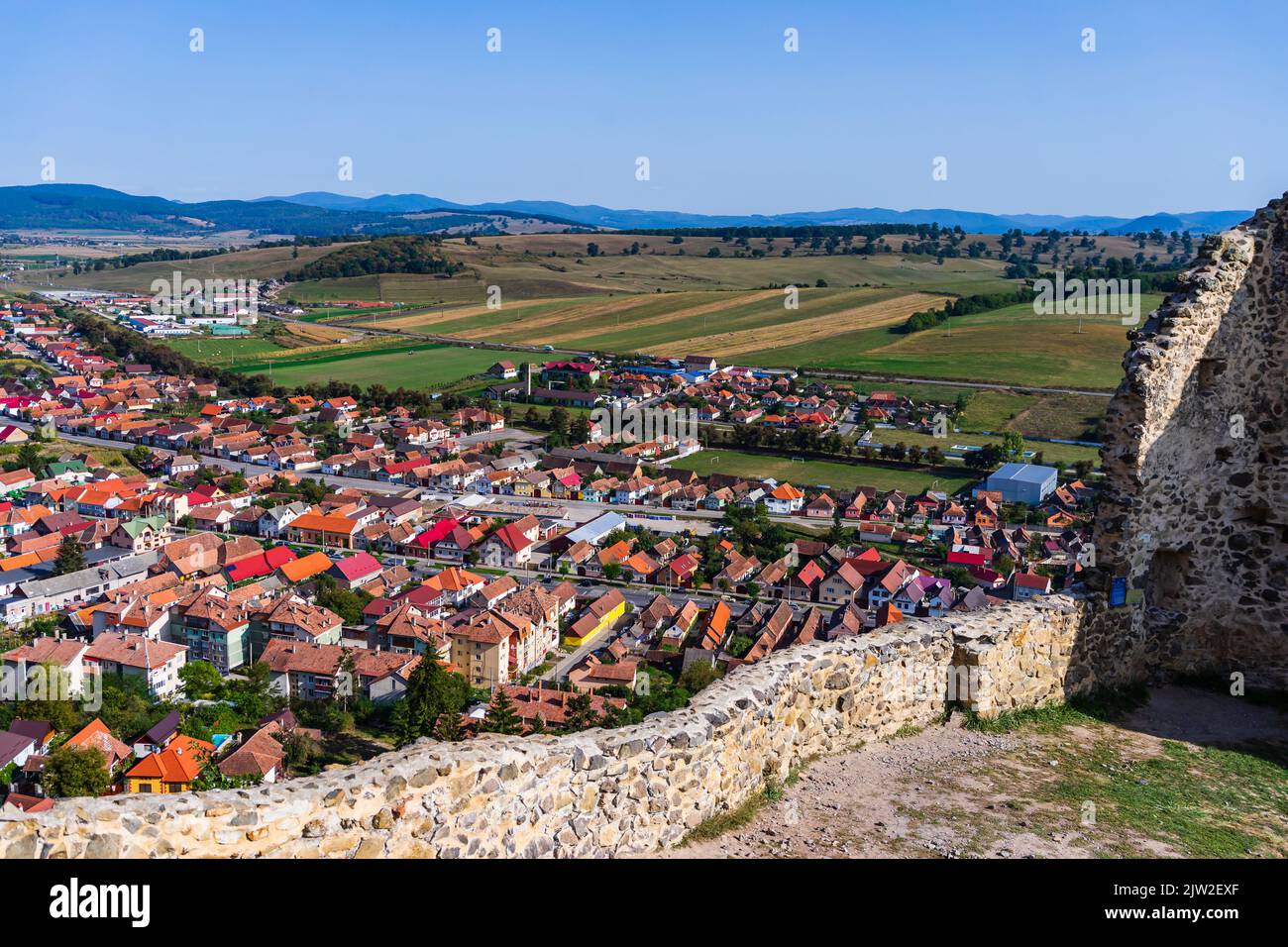 Aerial view of the town center with hills, buildings, streets ...