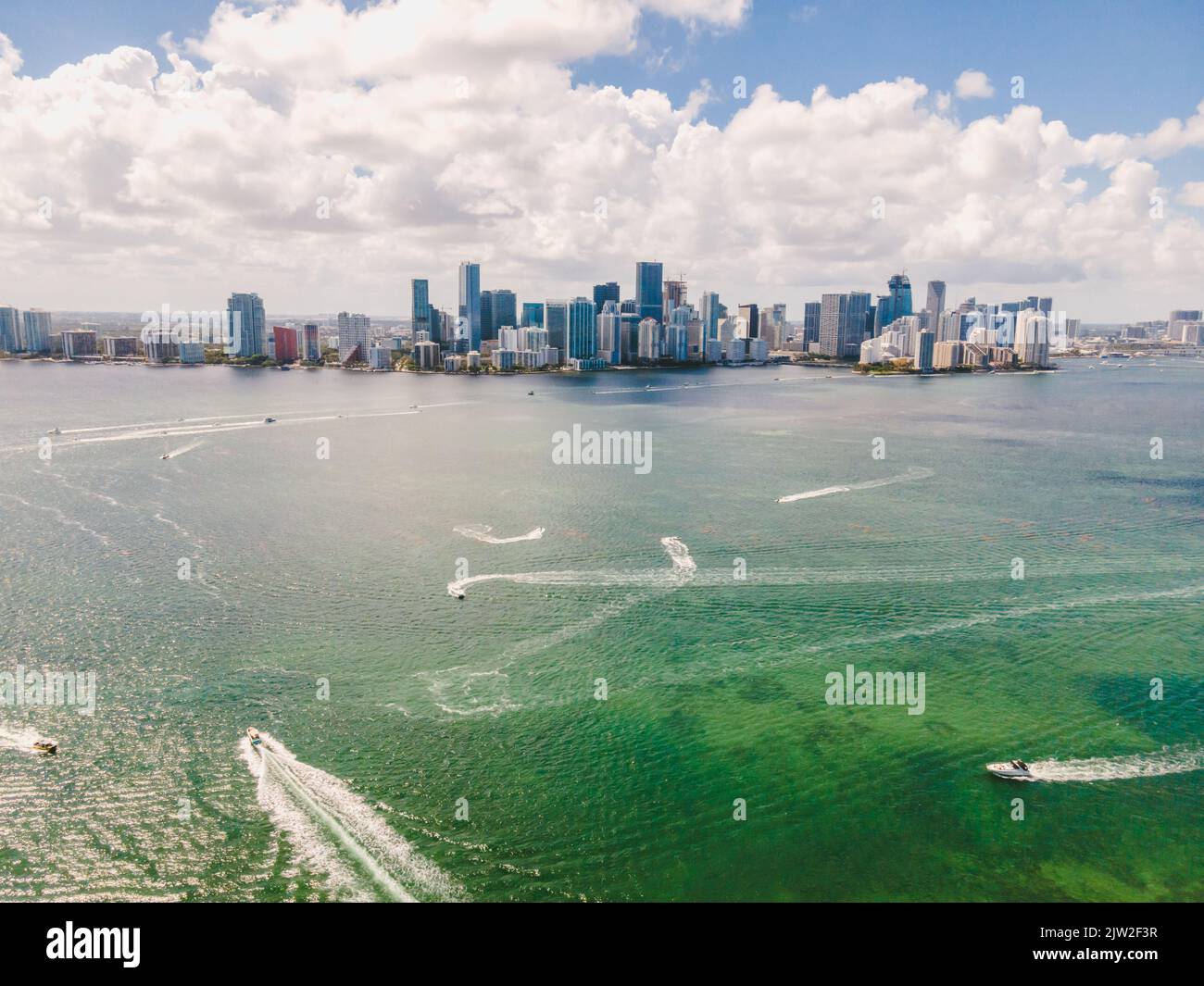 Amazing drone view of various motorboats floating in sea near ...