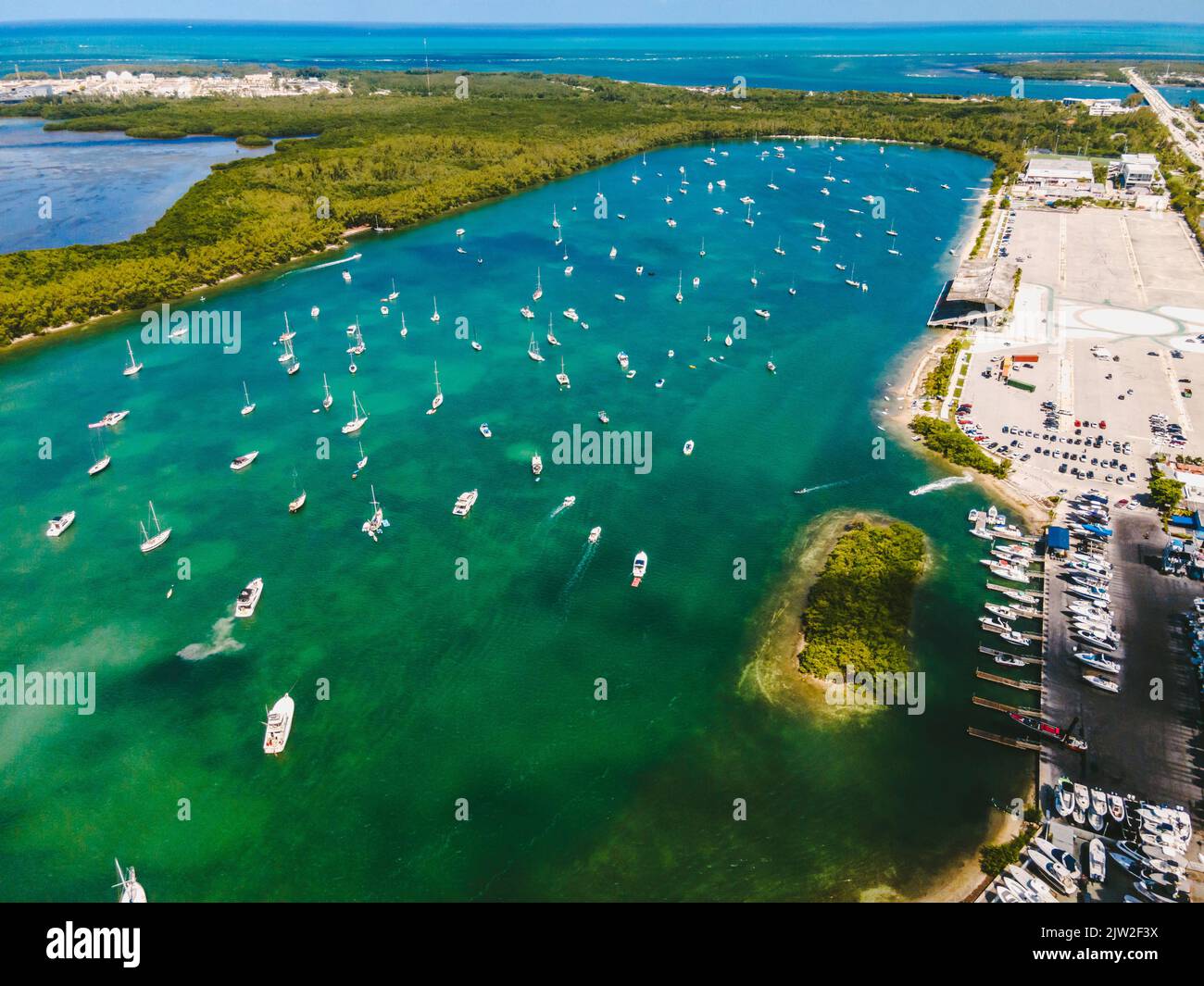 Picturesque aerial view of modern white yachts floating in turquoise ...