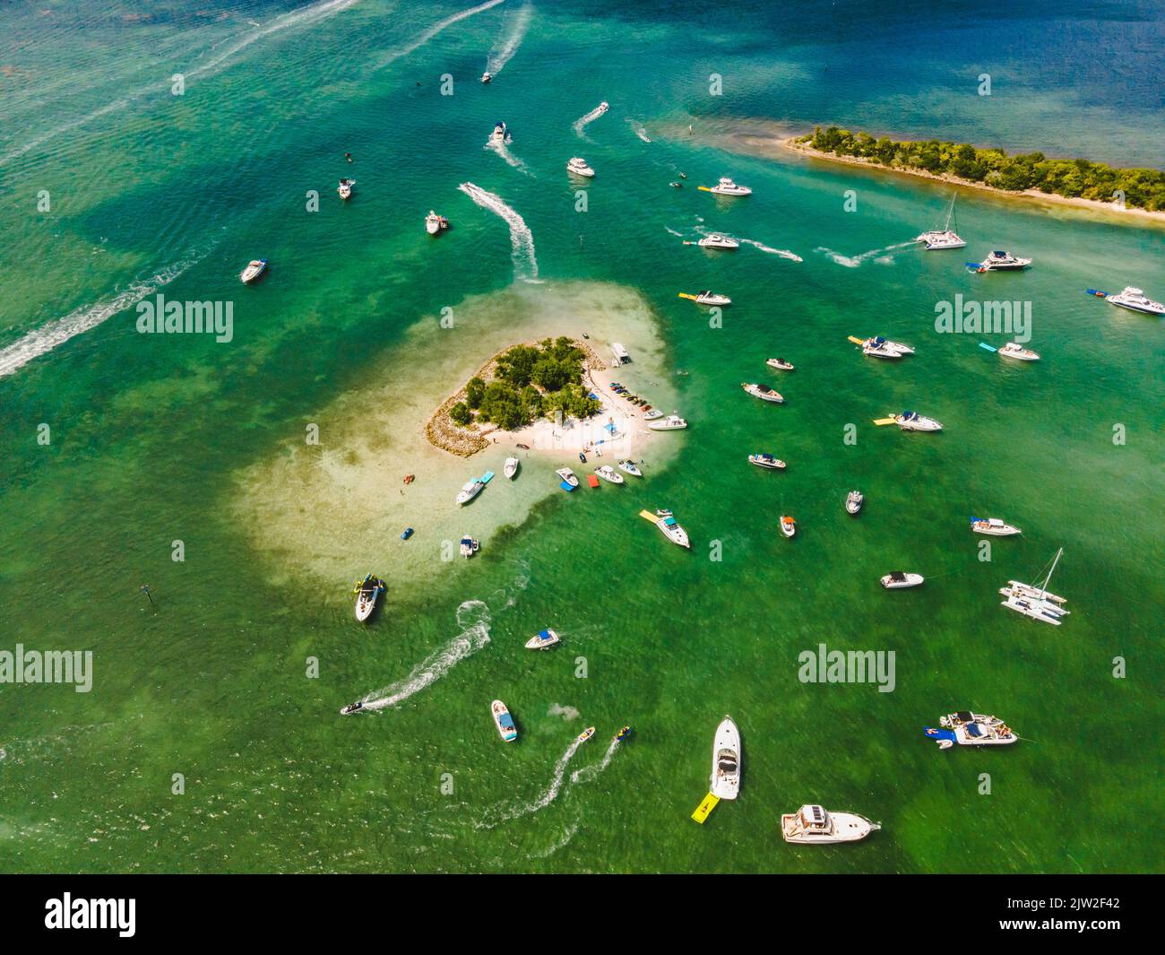 Scenic aerial view of modern boats and yachts floating in sea near ...