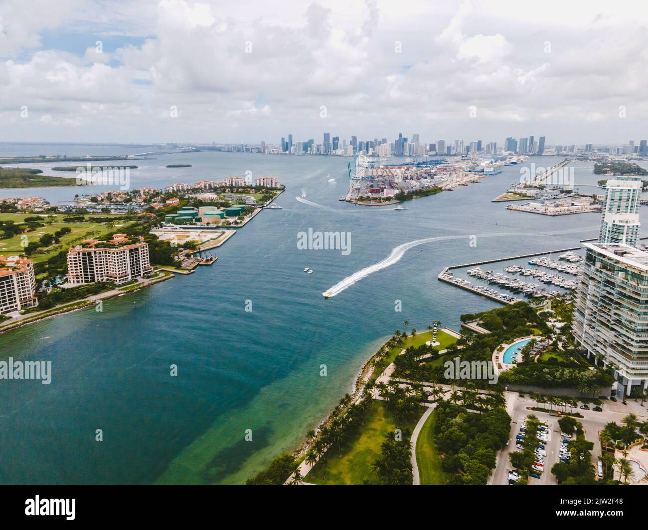 Breathtaking drone view of boat floating in sea near contemporary ...