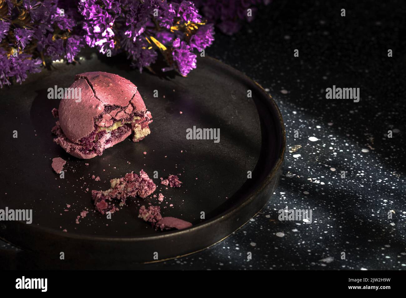 From above bouquet of fresh violet flowers placed on marble table near ...