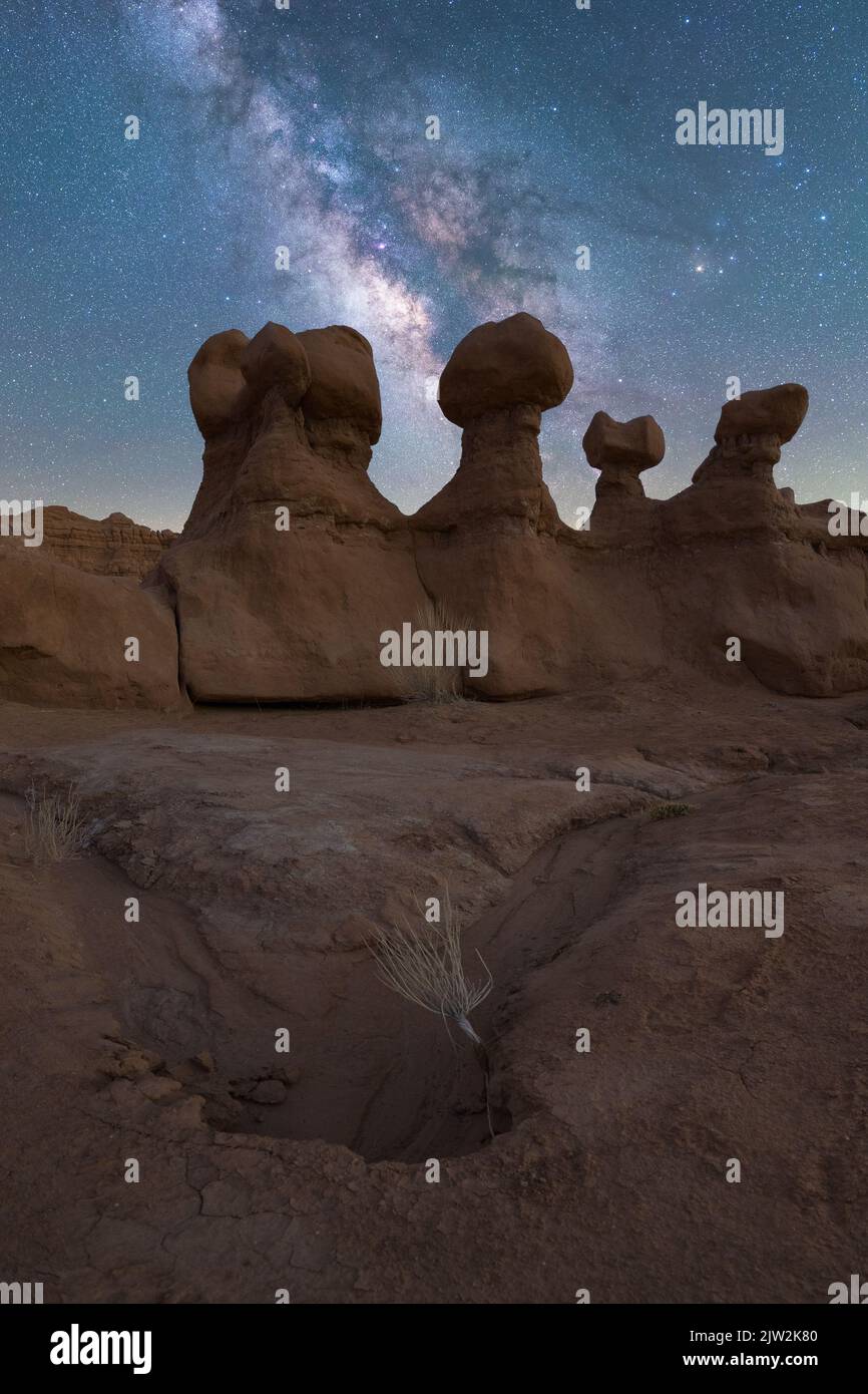 Unusual rock formations located against magnificent starry sky near ...