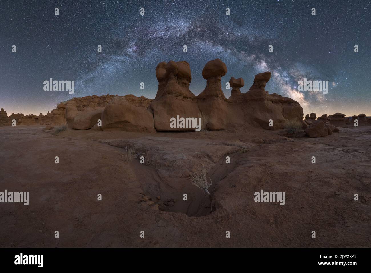 Unusual rock formations located against magnificent starry sky at night ...