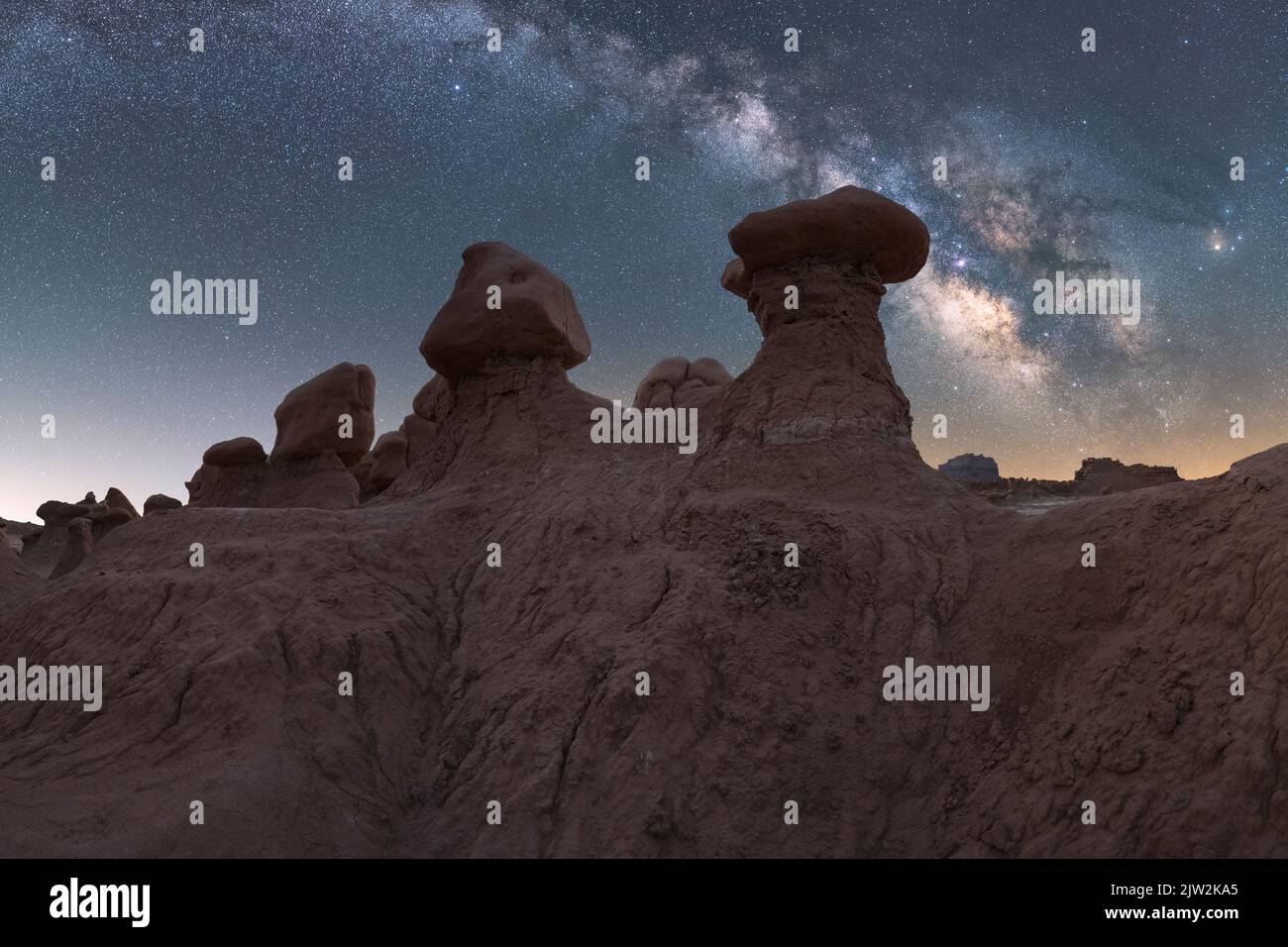 Unusual rock formations located against magnificent starry sky at night ...
