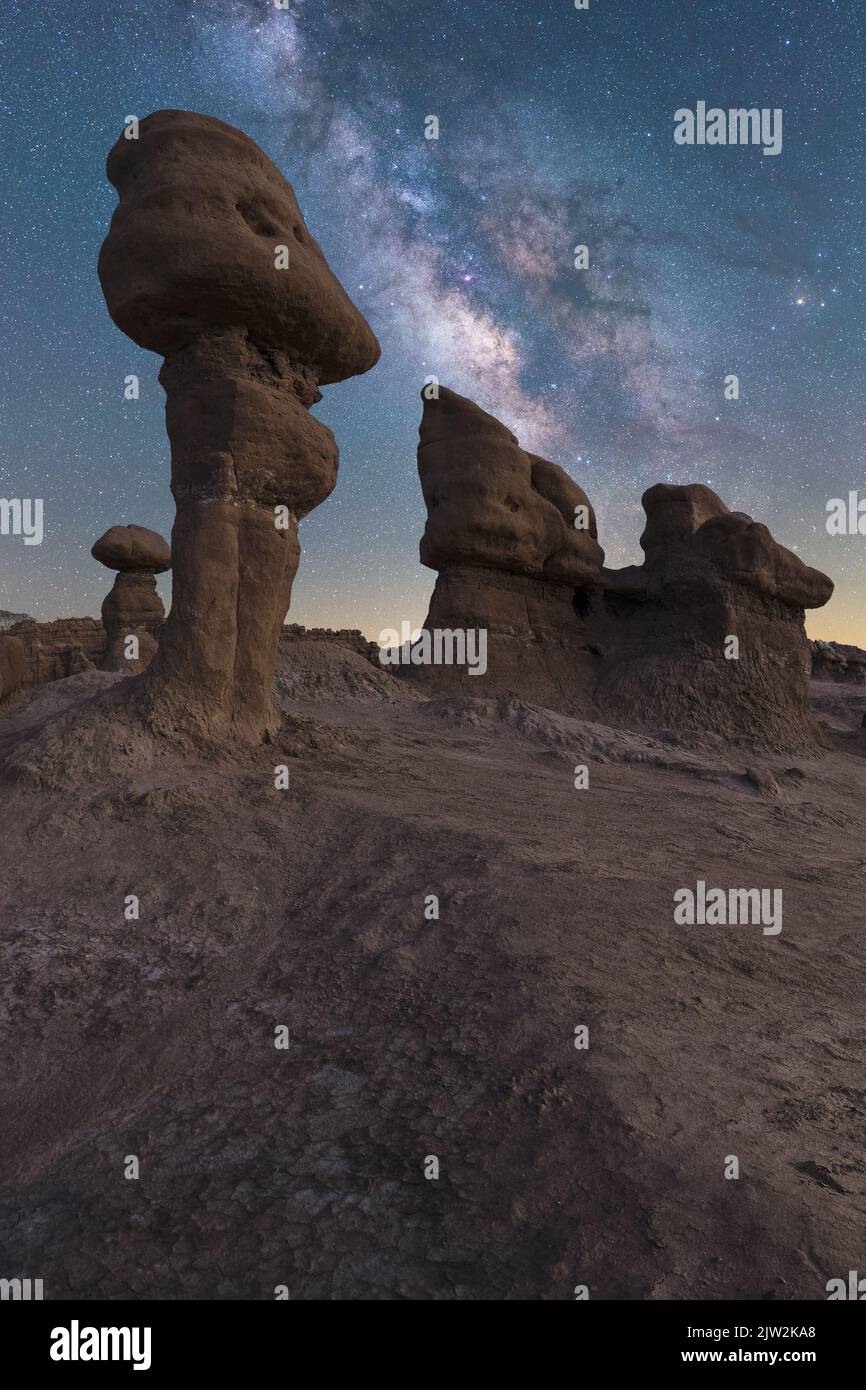 Unusual rock formations located against magnificent starry sky at night ...