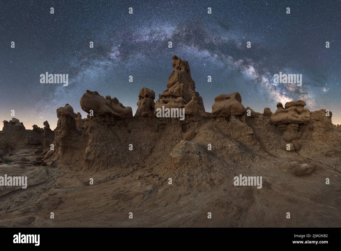 Unusual rock formations located against magnificent starry sky at night ...