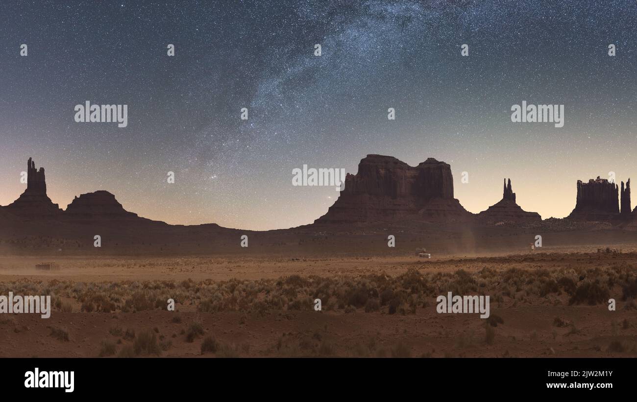 Breathtaking view of arid desert with bushes and uneven mountains ...