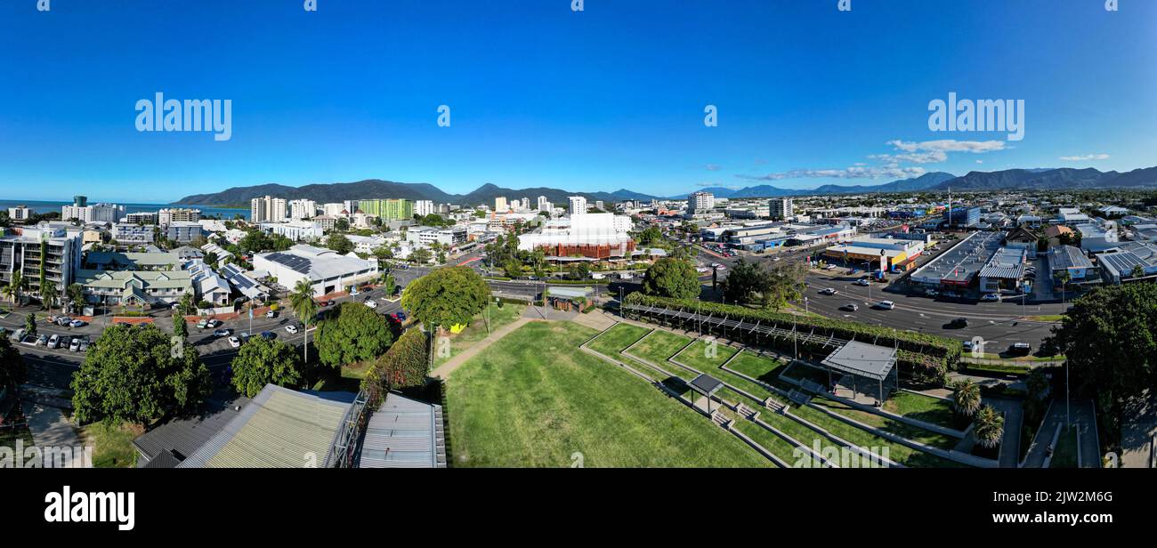 Aerial panorama of park and cityscape with mountains and peffect blue ...