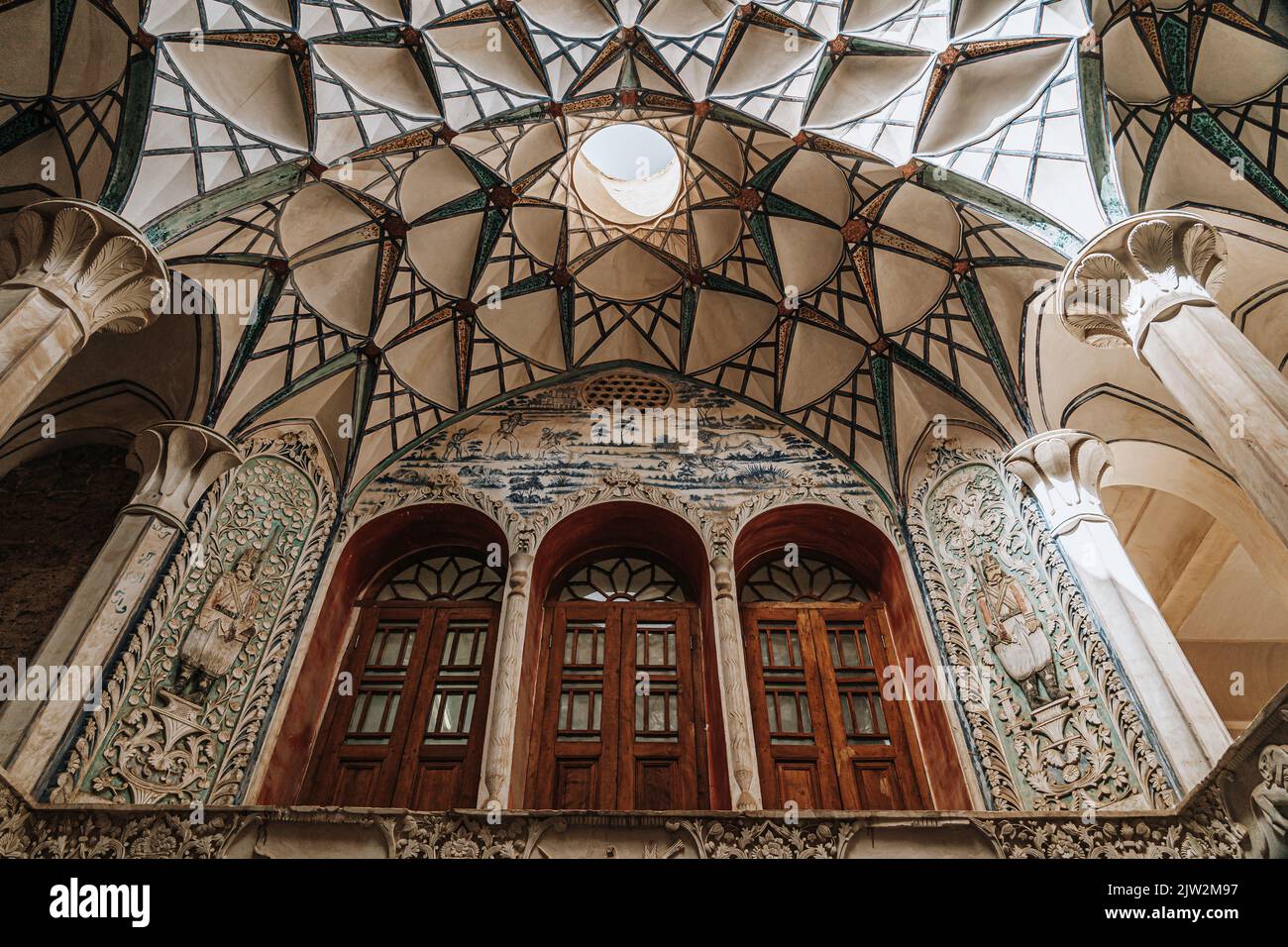 From below of traditional medieval mosque with arched elements and ...
