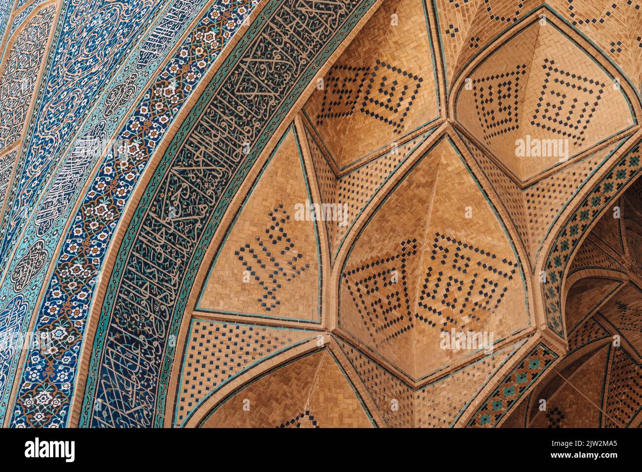 Low angle of detail of Jameh Mosque of Isfahan with geometric wall and ...