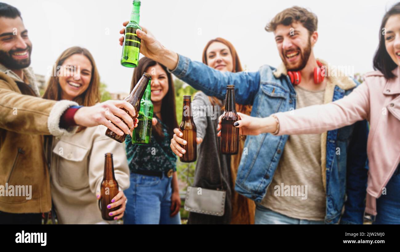 Gathering of millennial generation people having fun outdoors ...