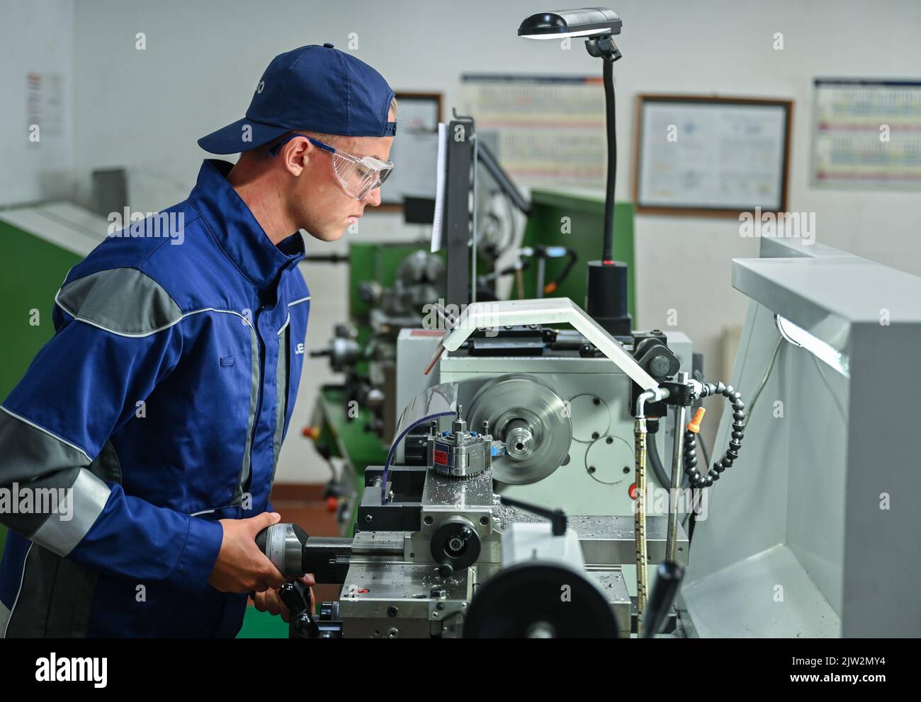 Peitz, Germany. 31st Aug, 2022. A mechatronics apprentice works on a ...