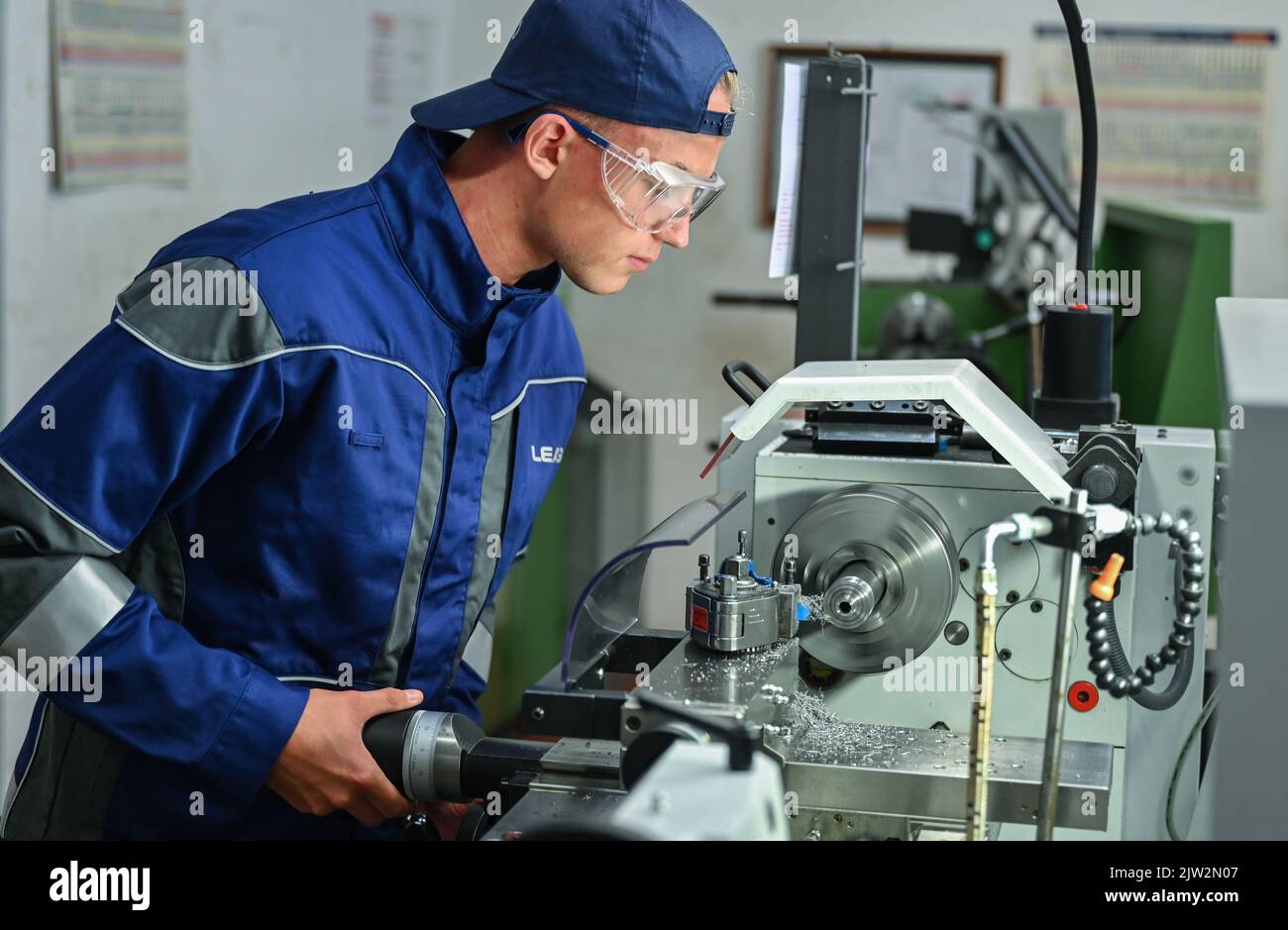 Peitz, Germany. 31st Aug, 2022. A mechatronics apprentice works on a ...