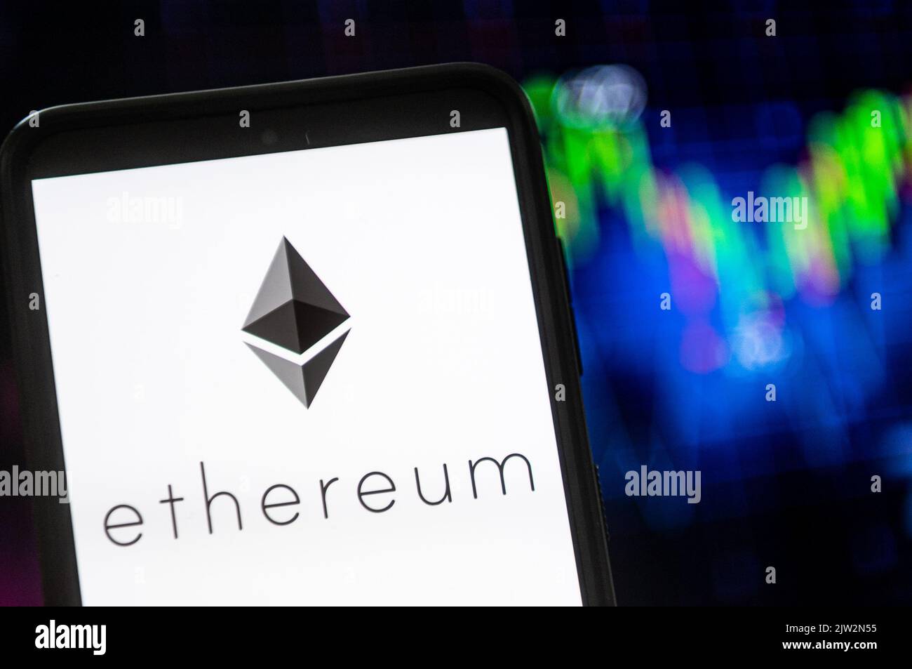 In this photo illustration a Ethereum logo seen displayed on a ...